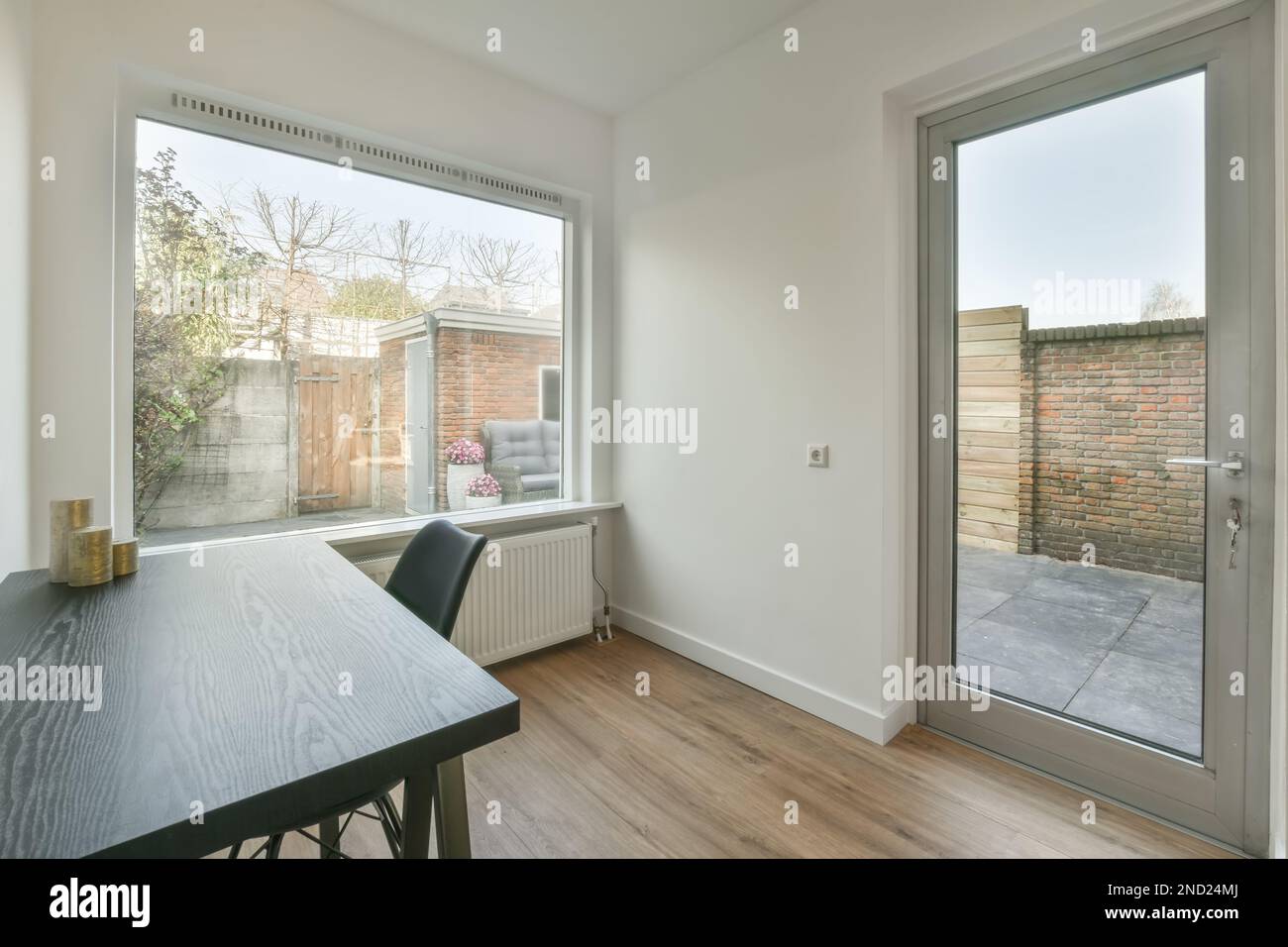 Interior design of modern room with desk table and chair placed near ...