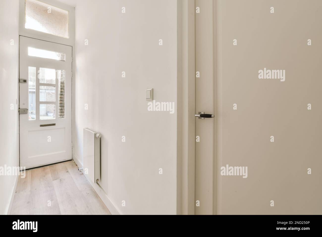 Interior design of light hallway with white walls radiator laminate and ...