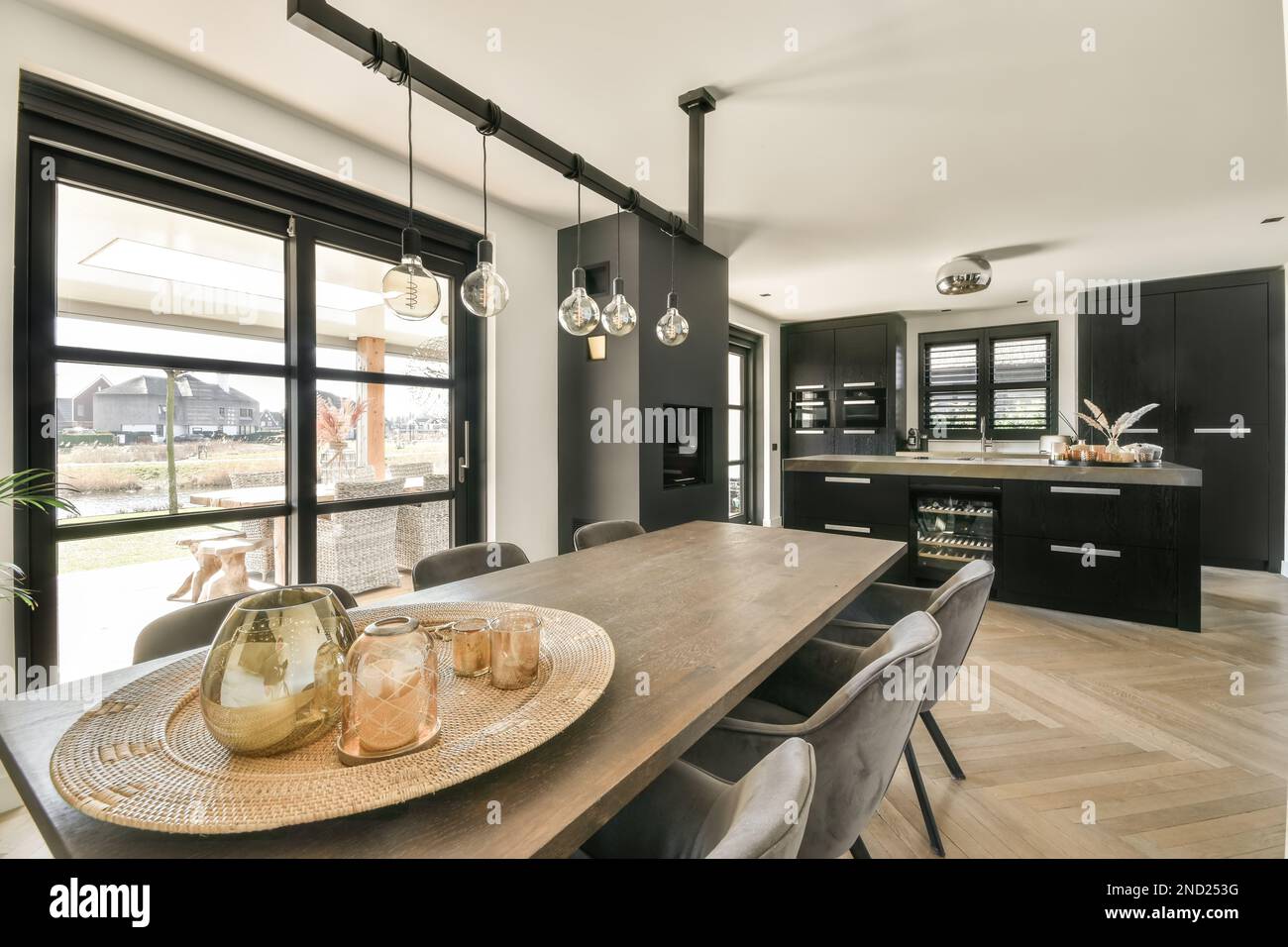 Interior design of dining area with table chairs near fireplace and ...