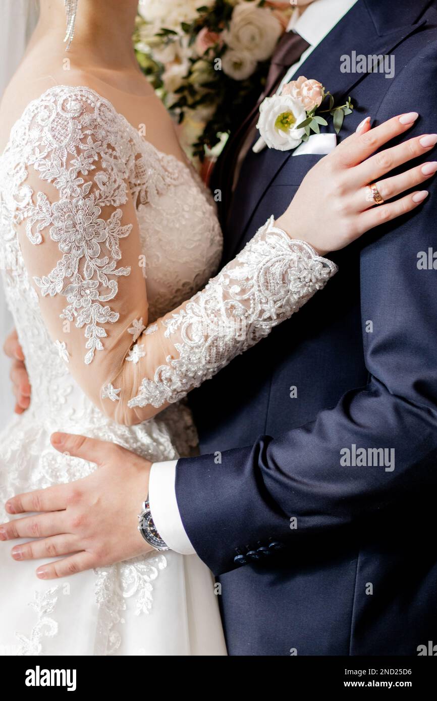 bride in a white wedding dress with the groom in a suit Stock Photo - Alamy