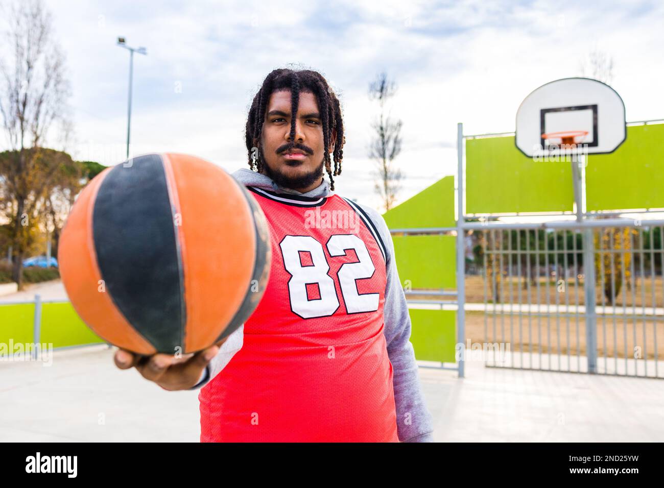 African American basketball player wearing red uniform with number 82 ...