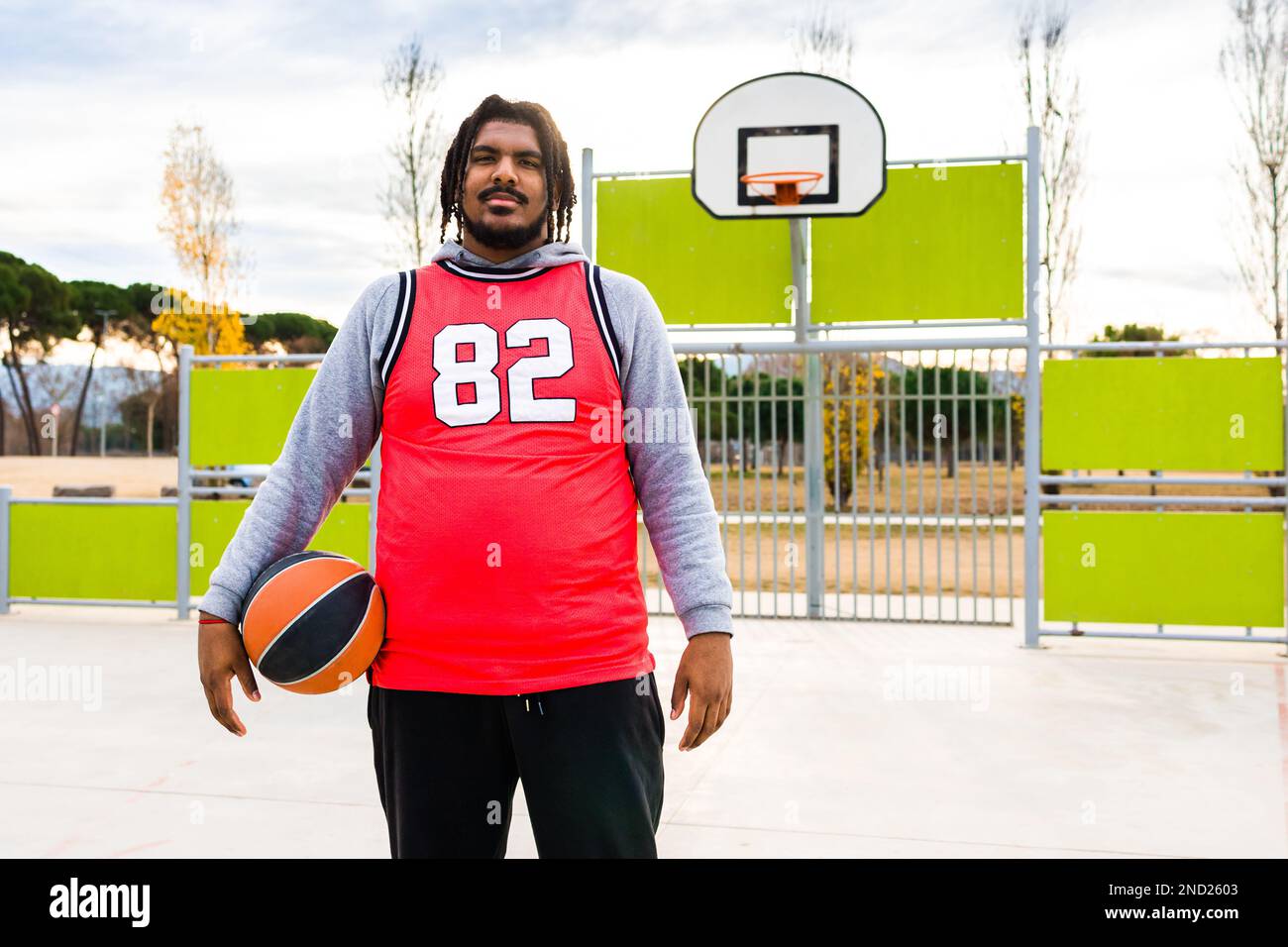 African American basketball player wearing red uniform with number 82 ...