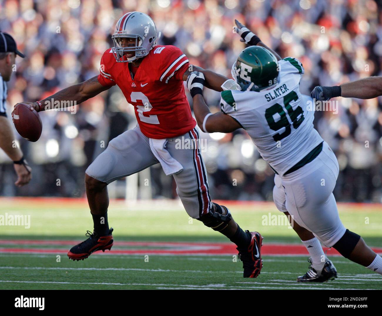 Ohio State's Terrelle Pryor, left, escapes the grasp of Eastern ...