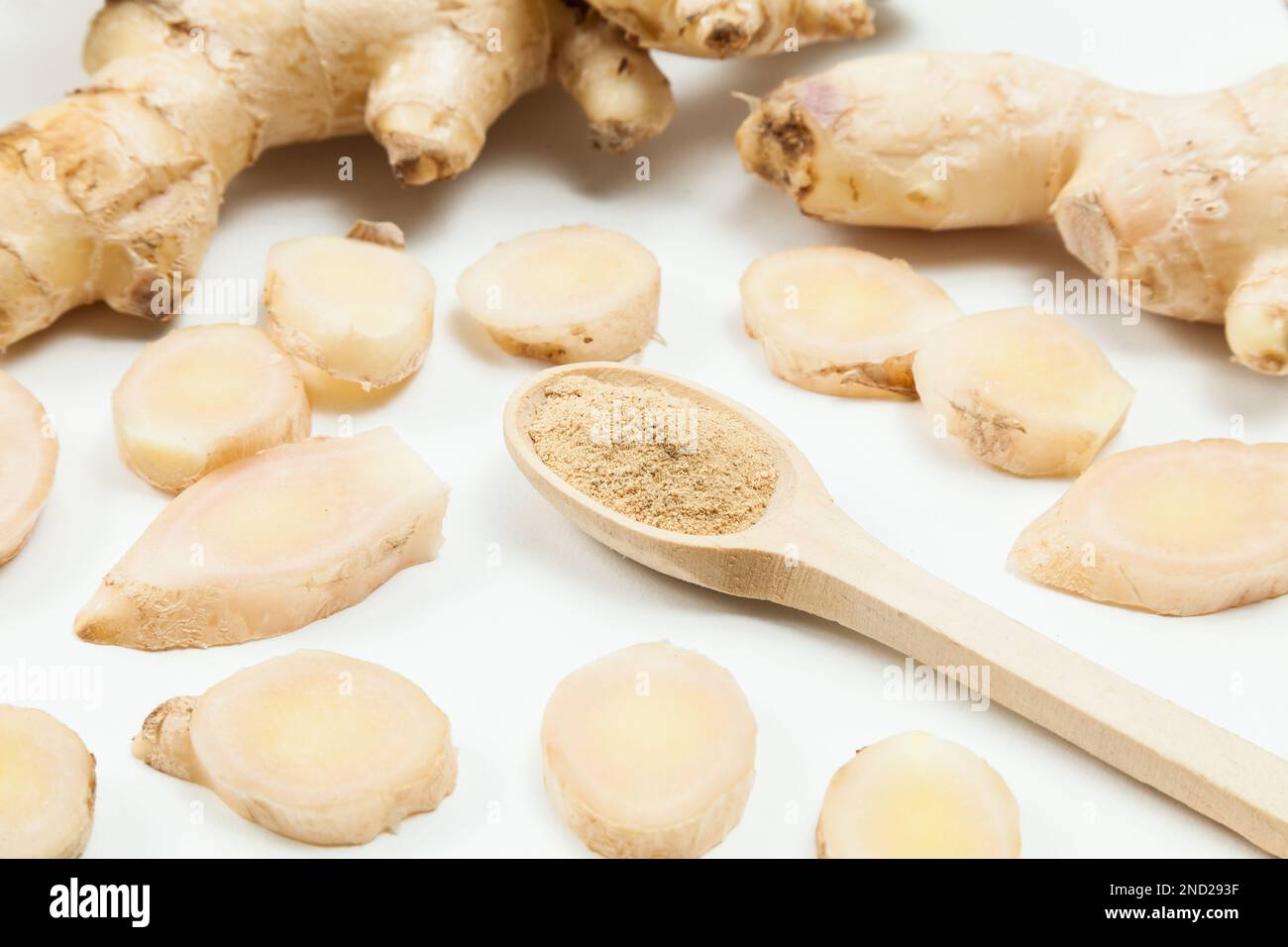 Fresh roots and ginger powder - Zingiber officinale; photo on wooden ...