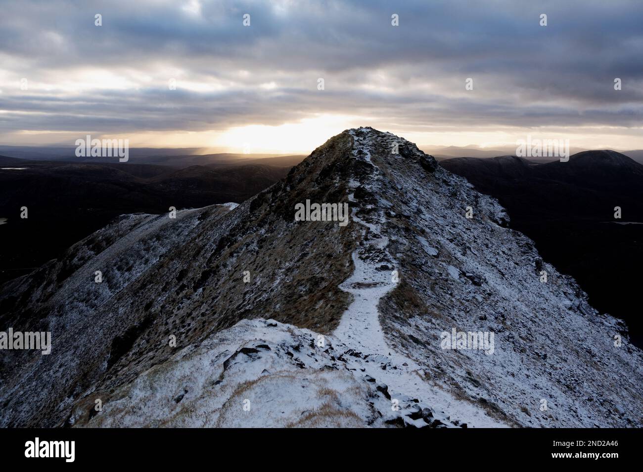 Sunrise on the top of Errigal mountain. Mount Errigal is the highest ...