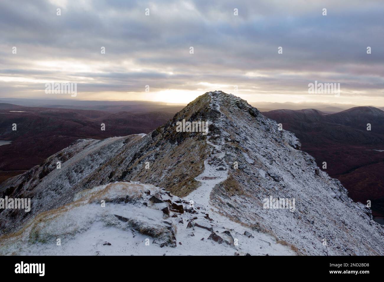 Sunrise on the top of Errigal mountain. Mount Errigal is the highest ...