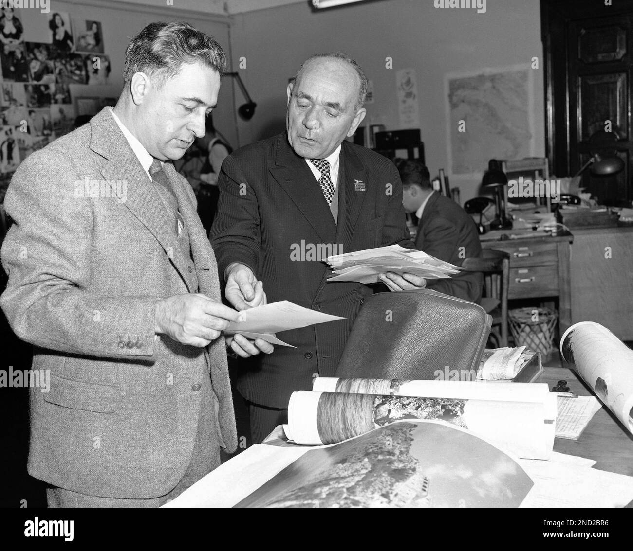 Italian archaeologist Costantino Cattoi points out sculptured rock he ...