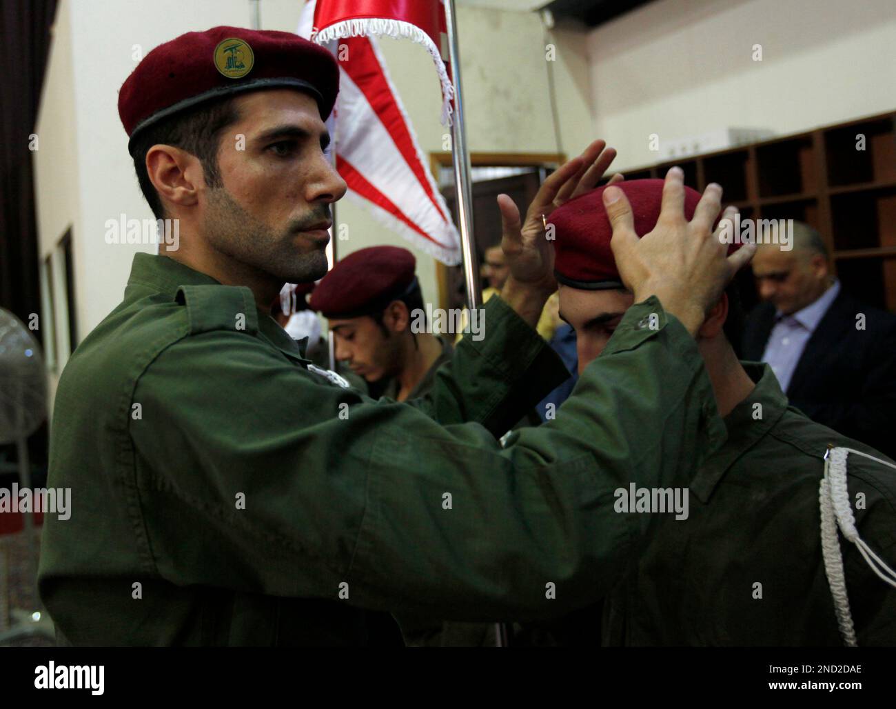 In this photo taken Friday, Sept. 3, 2010, a Hezbollah fighter, left ...