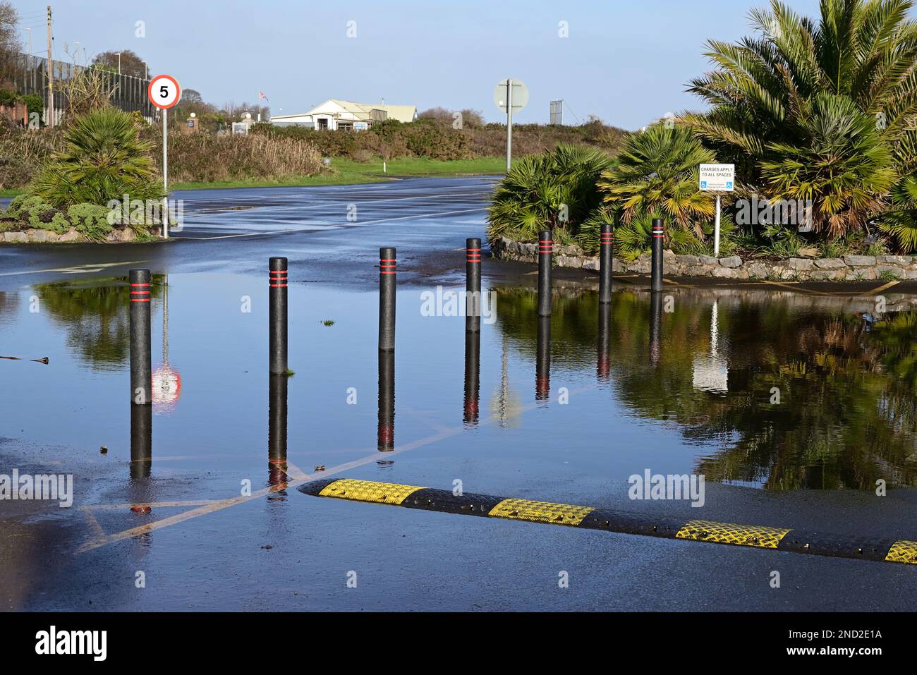 Reflections in a large puddle in Dawlish Warren car park, South Devon ...