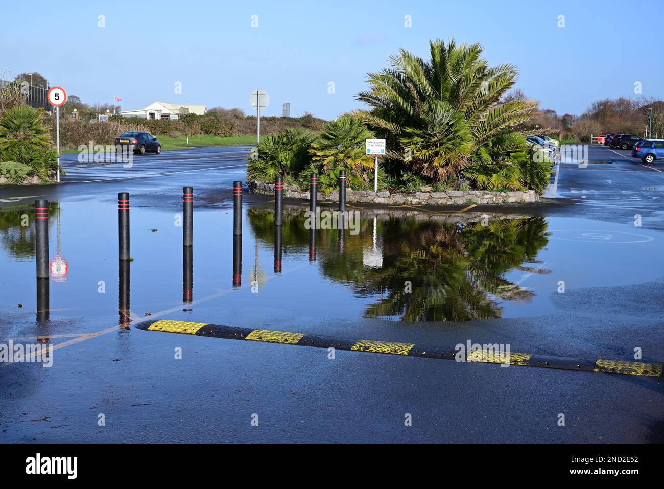 Reflections in a large puddle in Dawlish Warren car park, South Devon ...