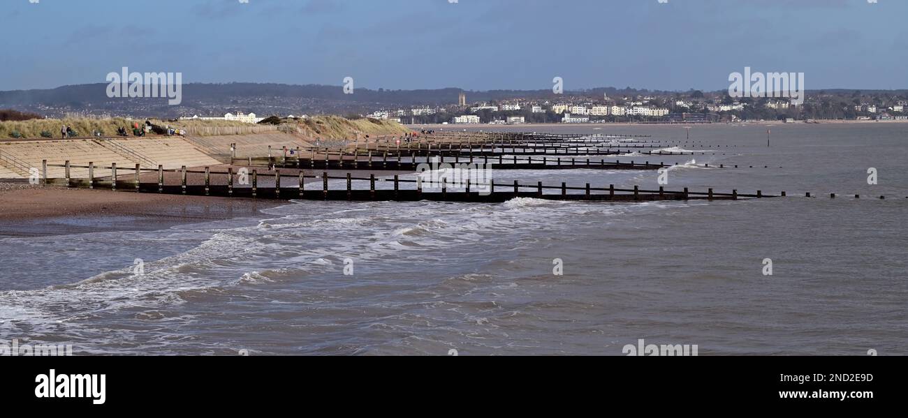 Incoming tide and groynes on Dawlish Warren beach, looking towards ...