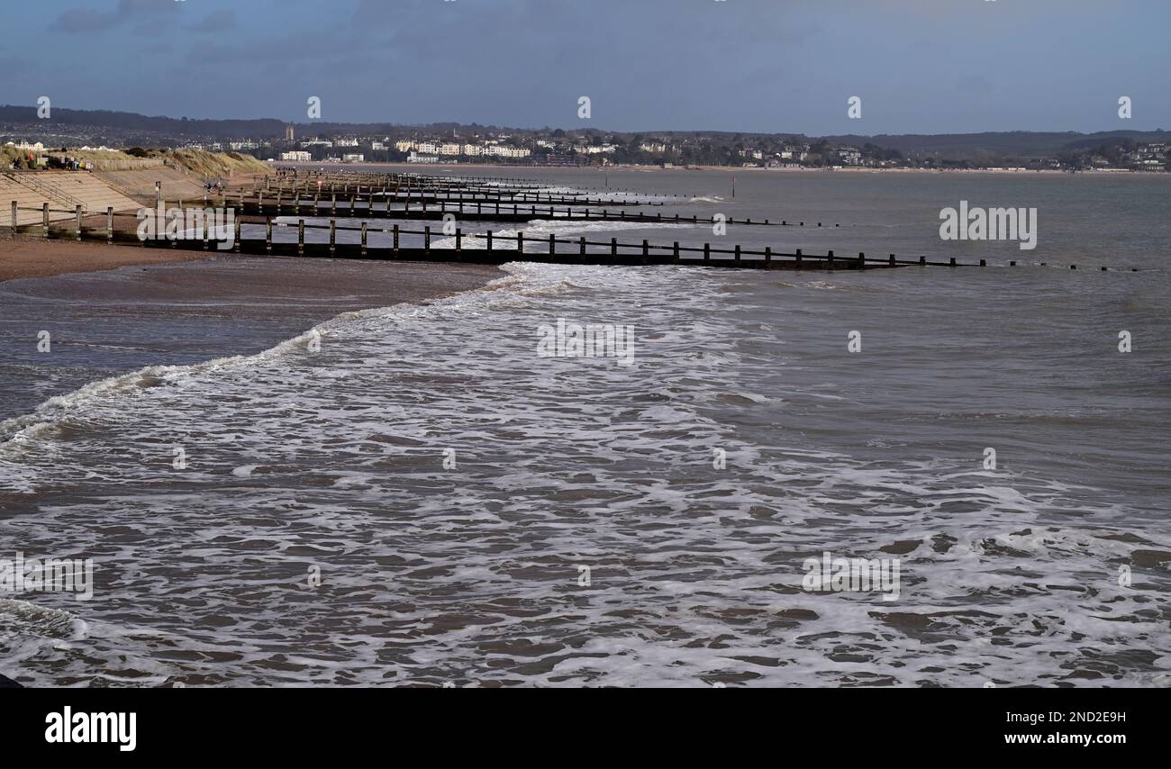 Incoming tide and groynes on Dawlish Warren beach, looking towards ...