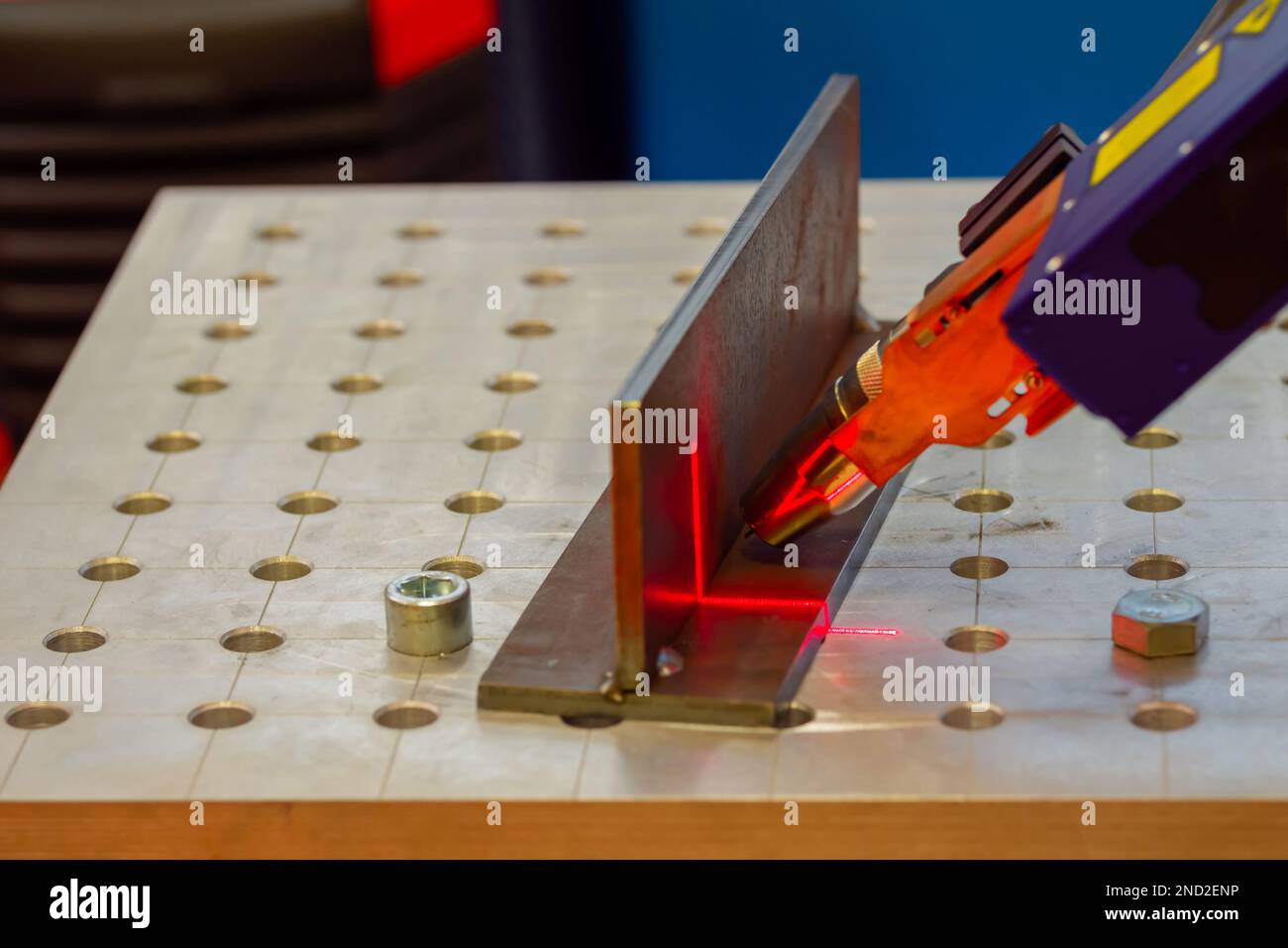 Industrial welding robotic arm scanning metal workpiece with laser ...