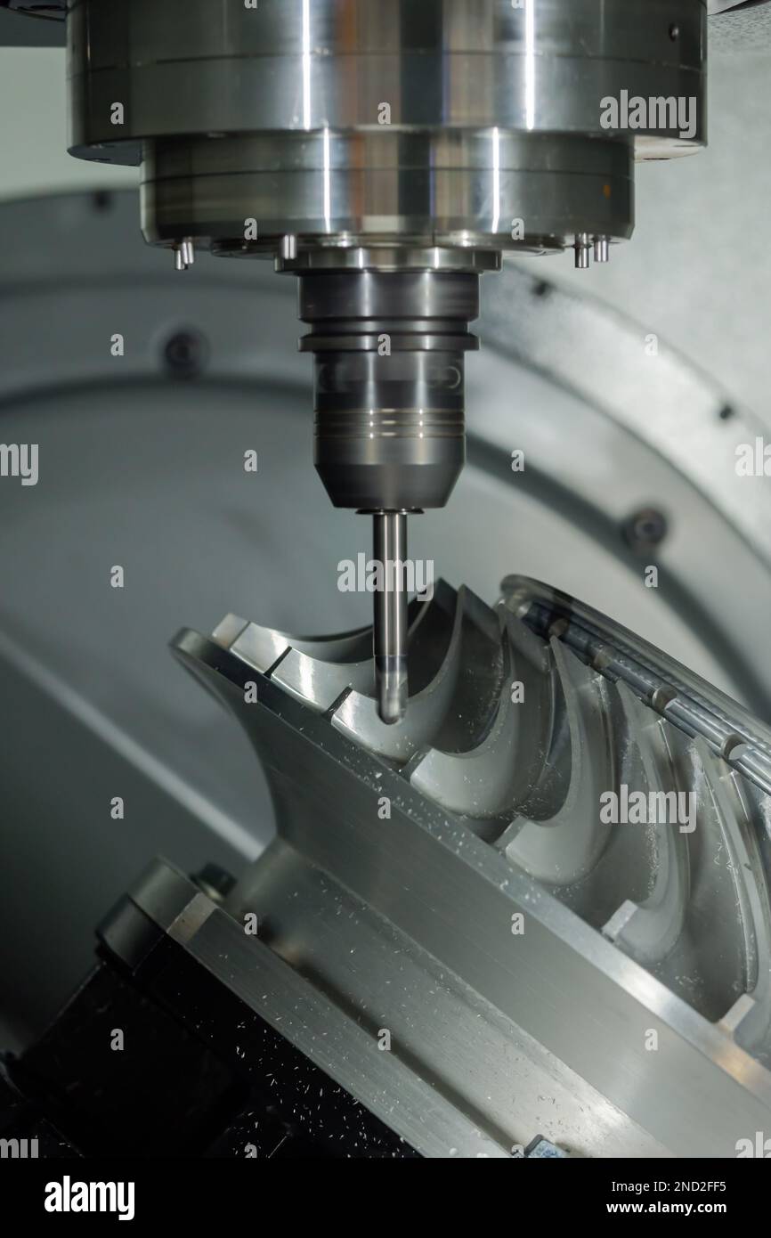 Automated cnc turning milling machine cutting metal workpiece at ...