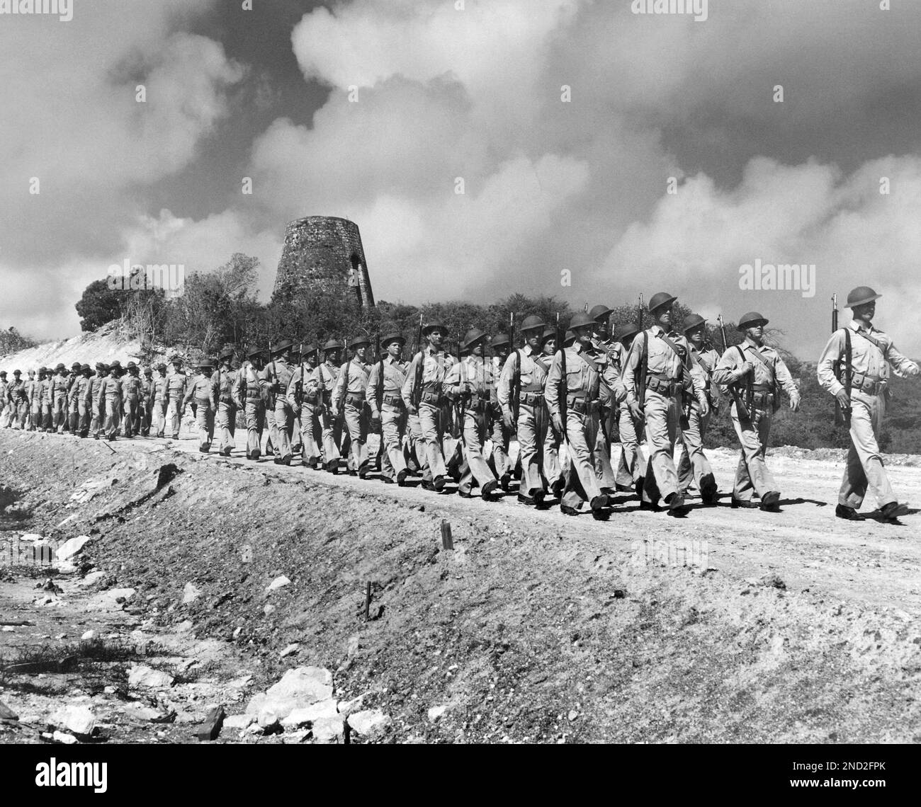 A typical Infantry Detachment of U.S. soldiers marching along a road ...