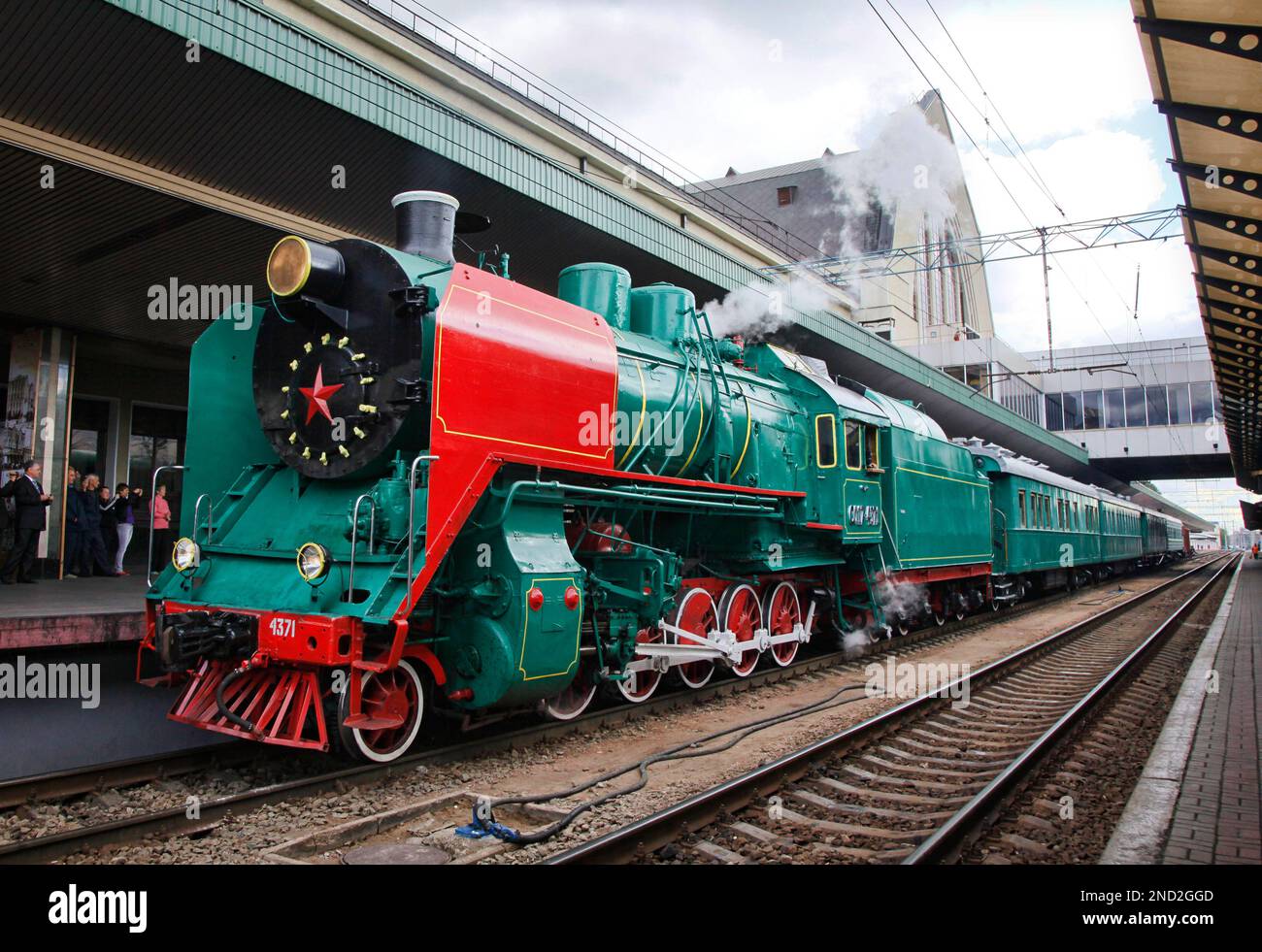 A 1870 renovated steam locomotive is seen arriving at a railway ...