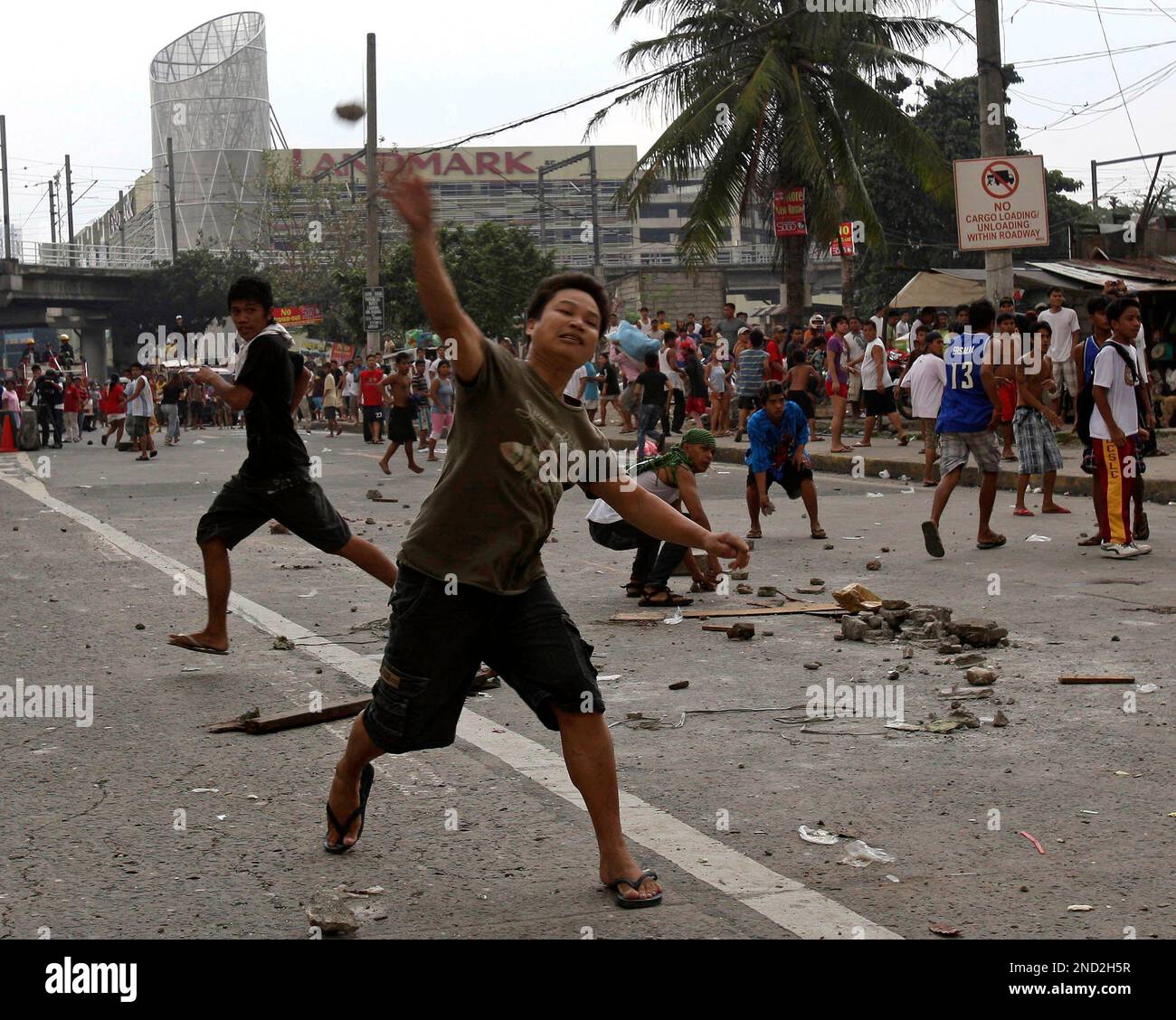 Residents throw rocks at police and demolition crew to resist ...