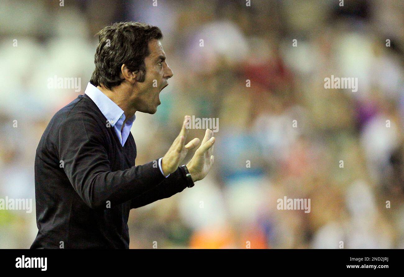 Atletico Madrid's Coach Quique Sanchez gestures to his players during ...