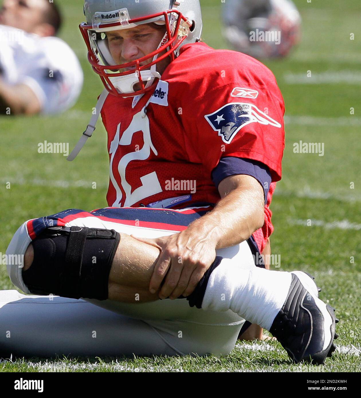 New England Patriots quarterback Tom Brady (12) stretches before ...