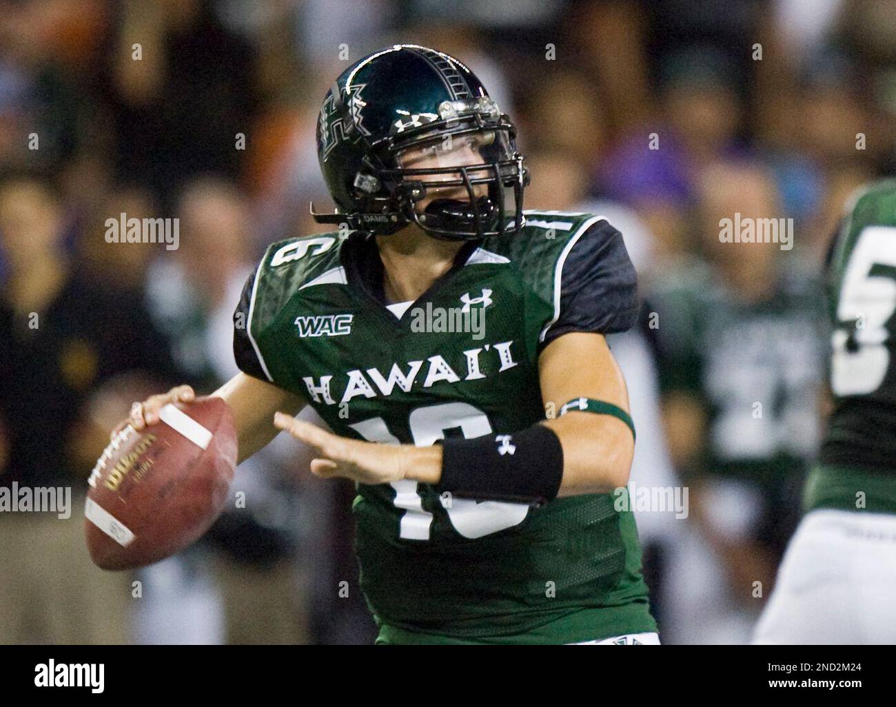 Hawaii quarterback Brent Rausch (16) drops back to pass in the fourth ...