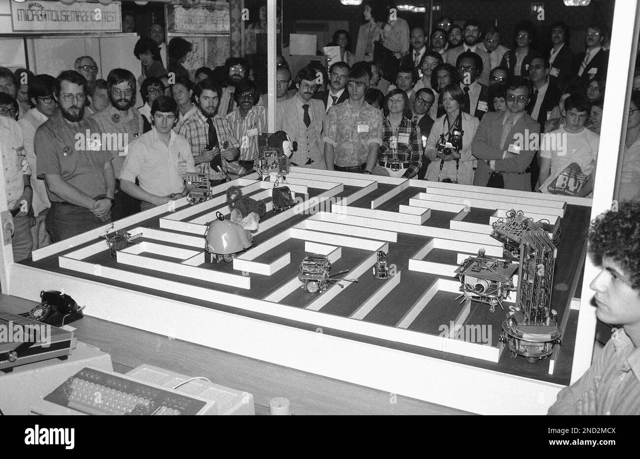 Spectators follow the mechanical mice going through a maze at the ...