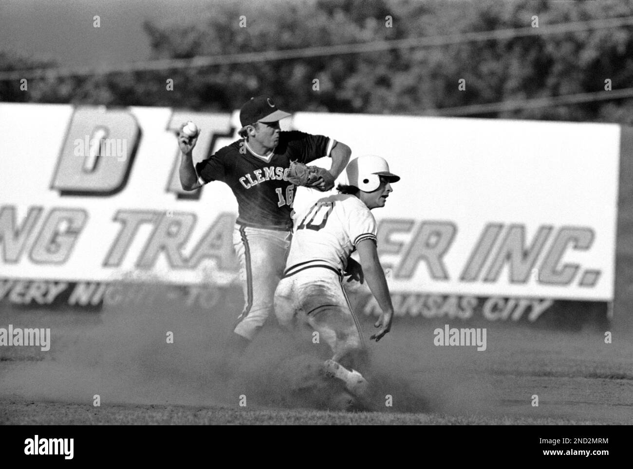 Glenn Ambrose of Eastern Michigan crashes into Clemson second baseman ...