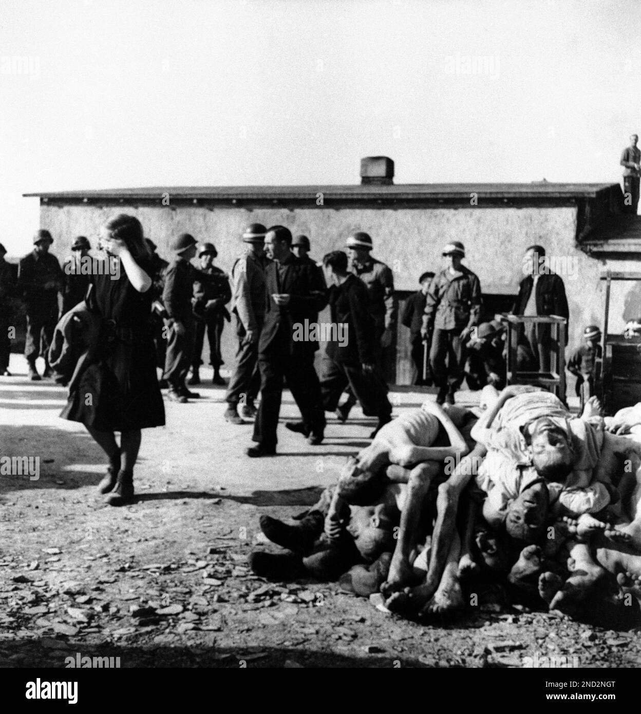 A German woman cries bitterly as she is led with other Germans citizens ... A German woman cries bitterly as she is led with other Germans citizens ...