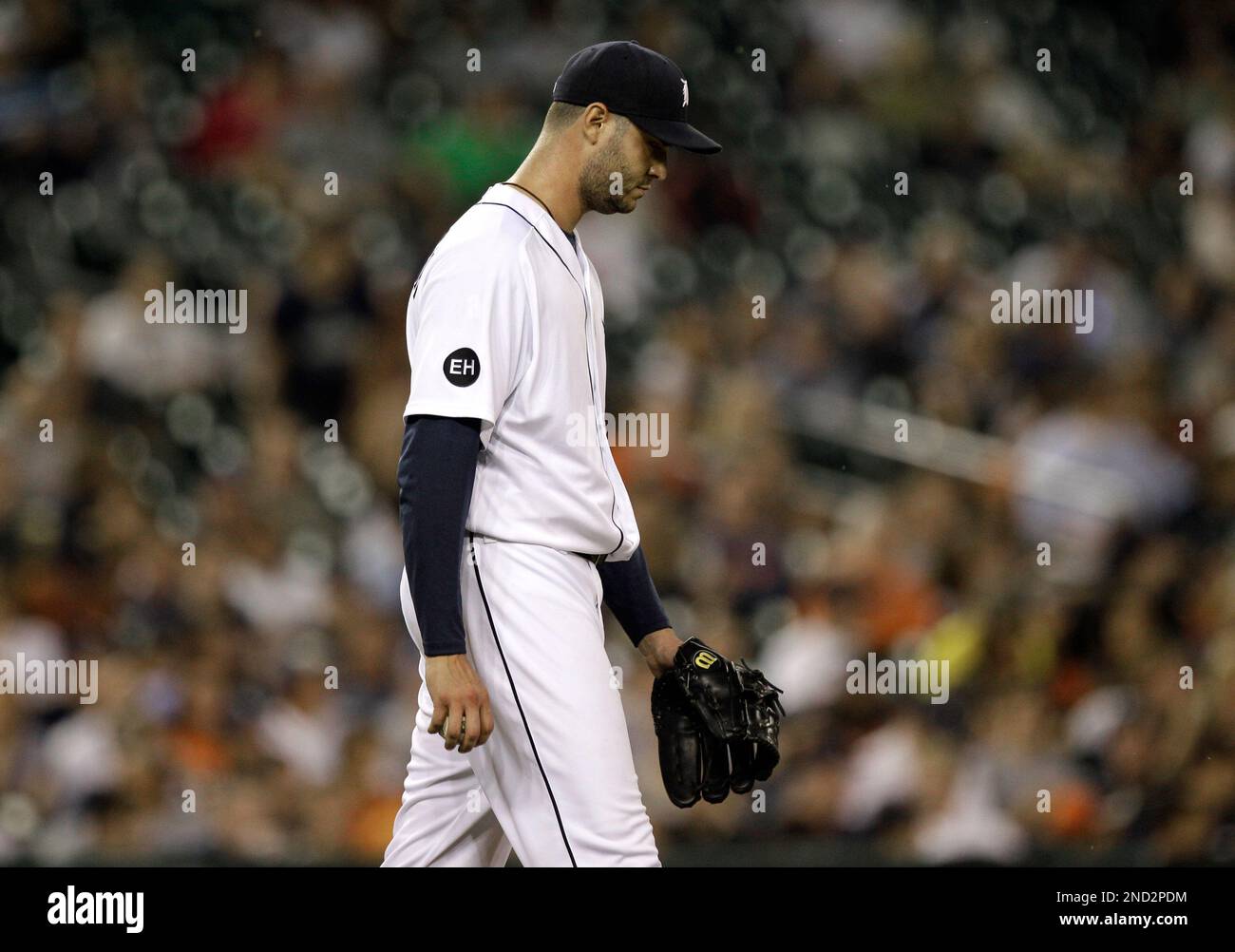 Detroit Tigers pitcher Armando Galarraga walks back to the mound ...
