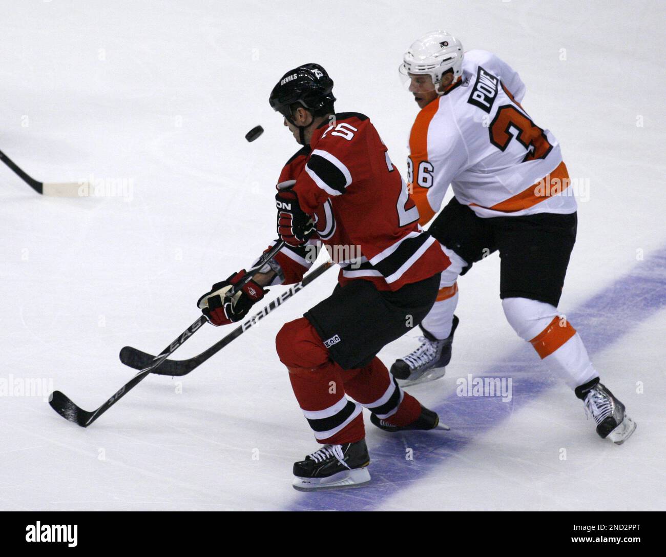New Jersey Devils' Jason Arnott, left and Philadelphia Flyers' Darroll ...