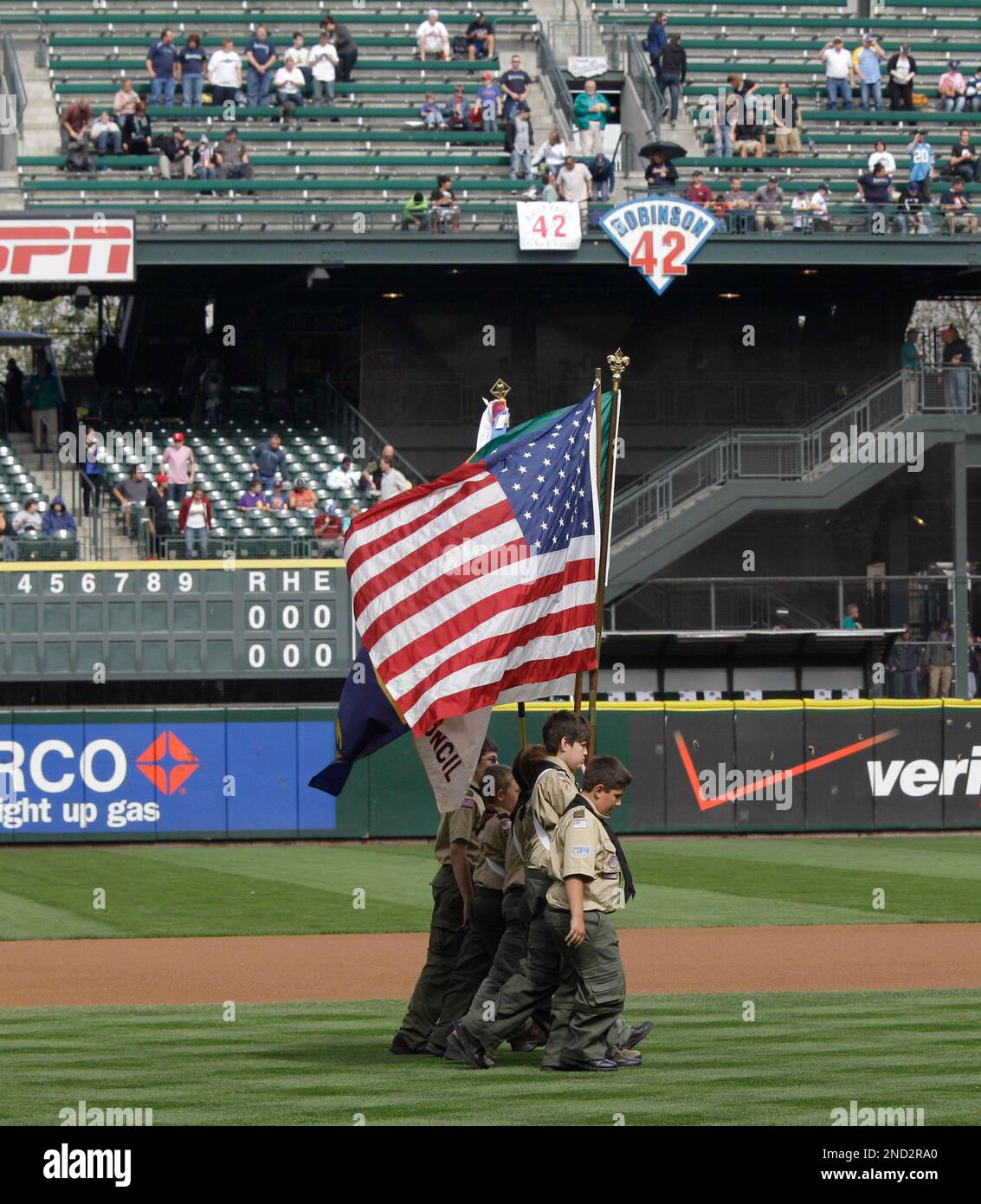 Boy Scout Troop 288, of Snohomish, Wash., carry flags at a baseball ...
