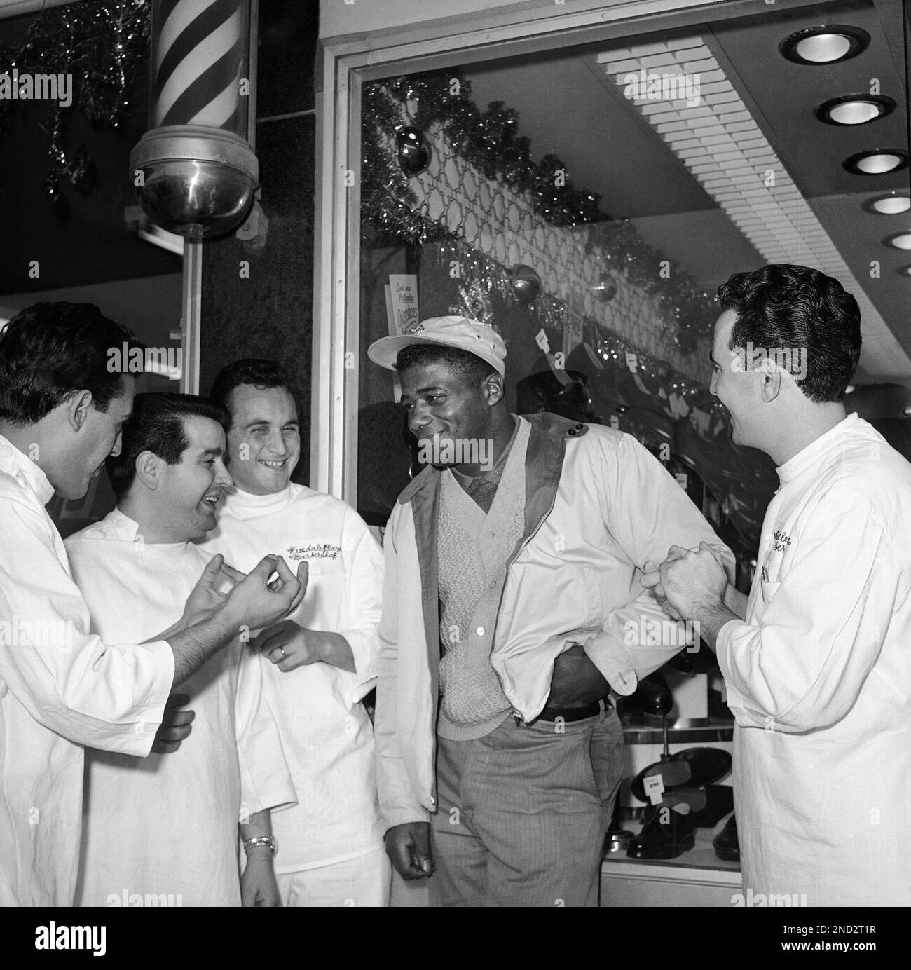 Heavyweight champion Floyd Patterson poses on steps of Bellarmine Hall ...