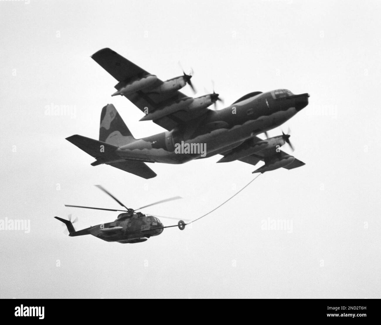 A U.S. helicopter, dubbed the jolly green Giant, eases itself under the ...