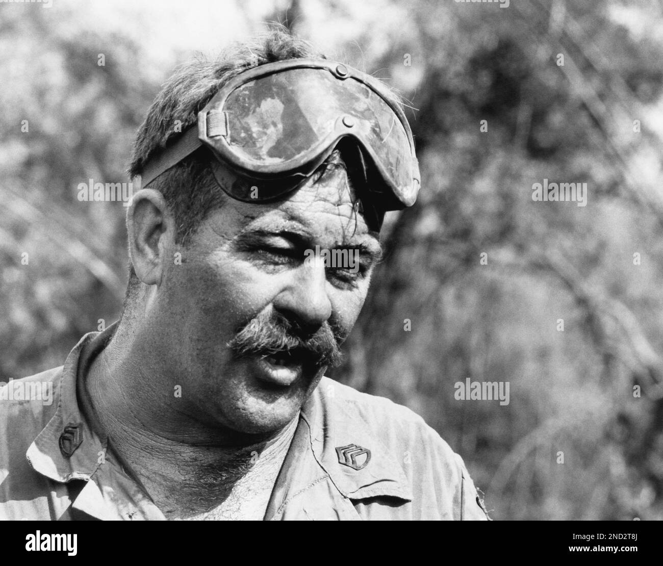 Staff Sgt. George T. Adkins, 38, of Lorain, Ohio, watches as tanks and ...