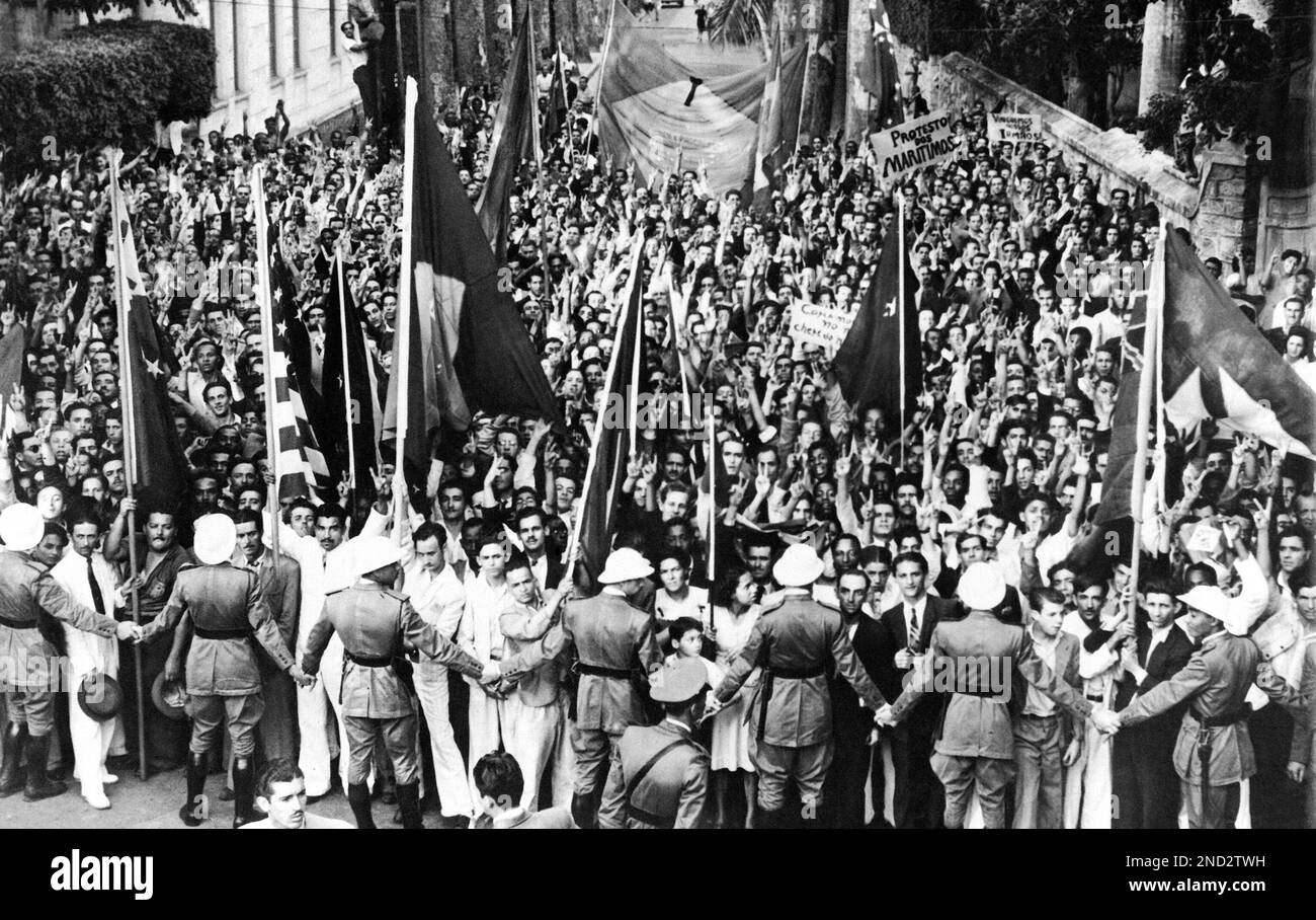 Carrying banners and flags Brazilian crowd in a Rio De Janeiro street ...