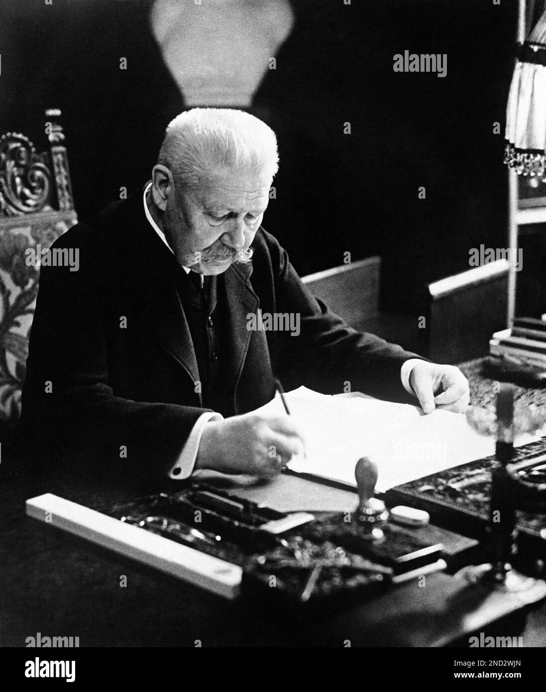 Paul von Hindenburg, President of Germany pictured at a desk around ...