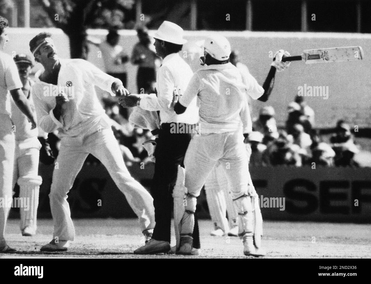 Cricket umpire Tony Crafter separates Australian fast bowler Dennis ...