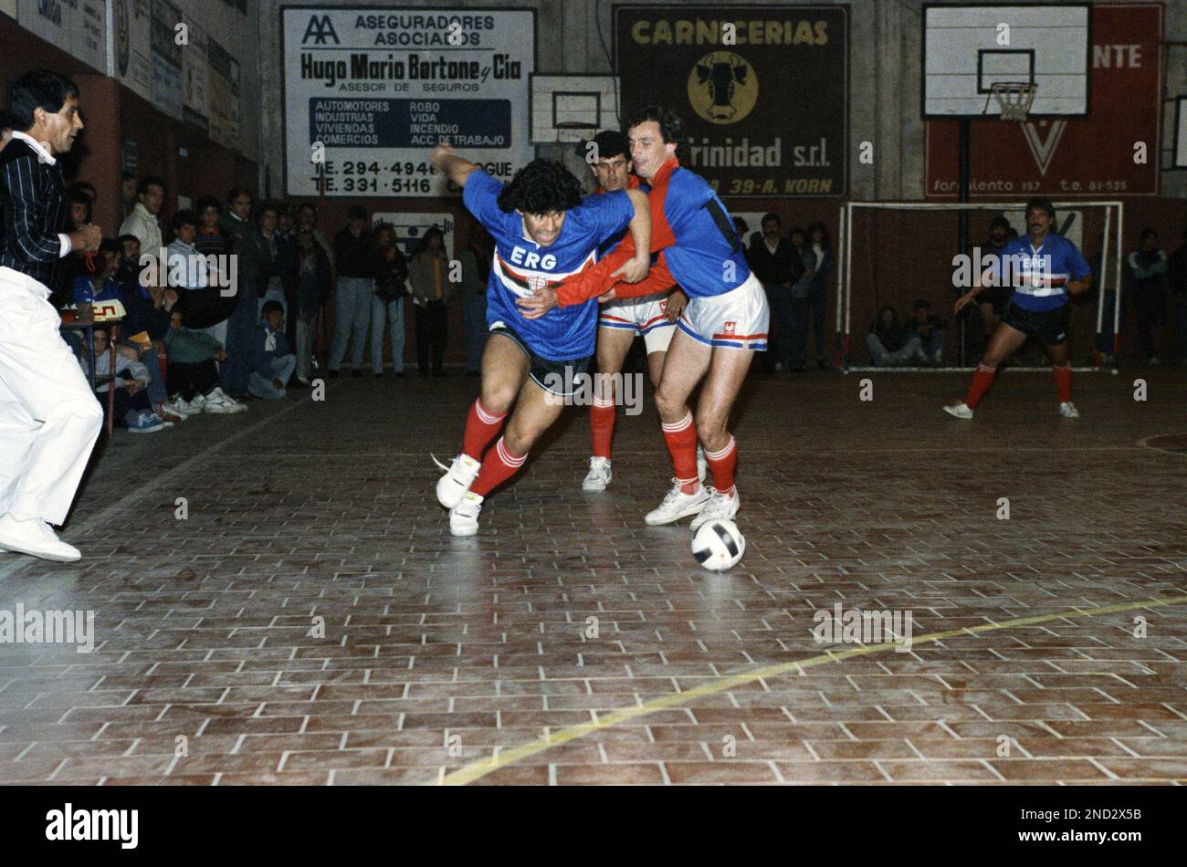 Argentina soccer ace Diego Maradona, left, runs for the ball chased by ...