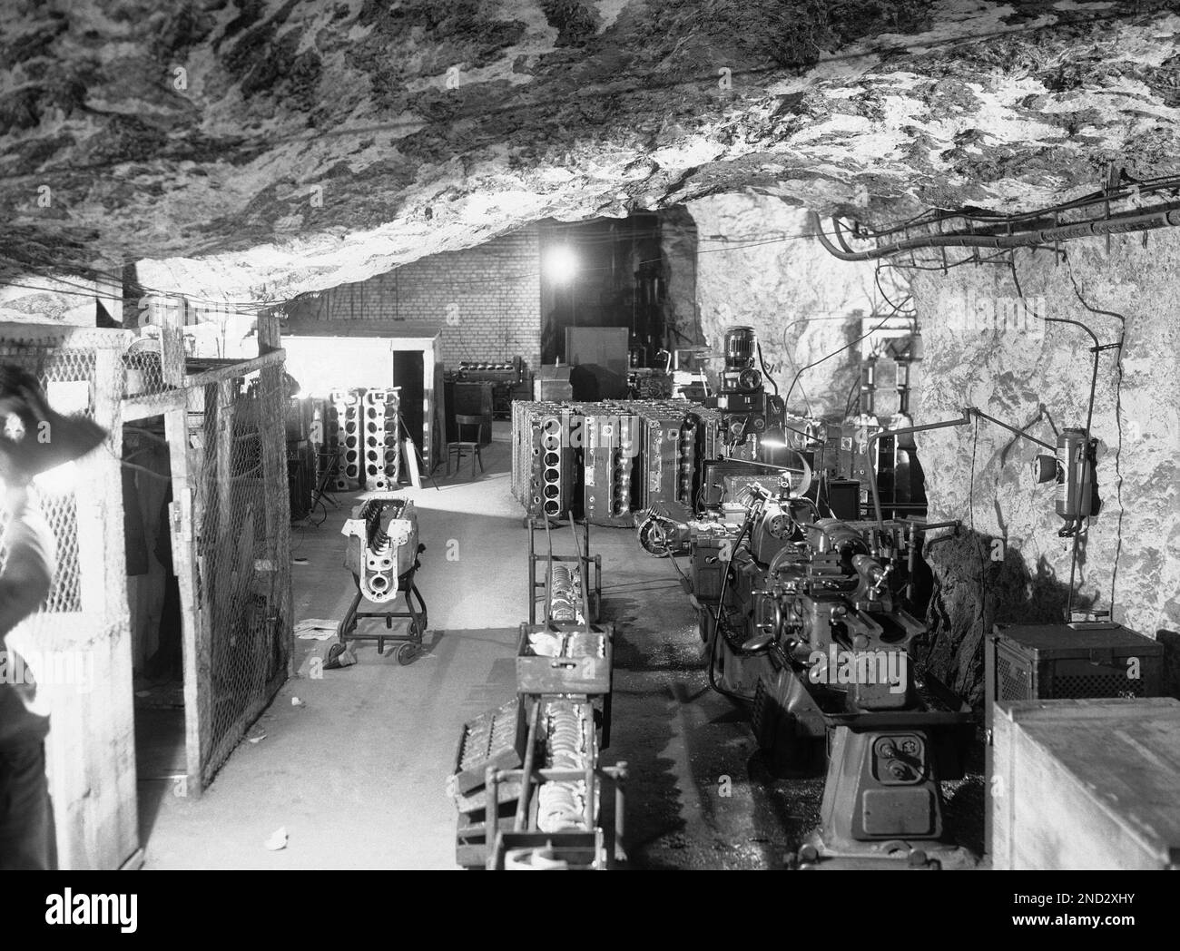 A view of one of the galleries with the foreman’s office, left, a lathe ...