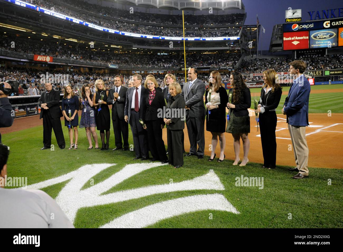 The Steinbrenner family stands behind home plate before going out to ...