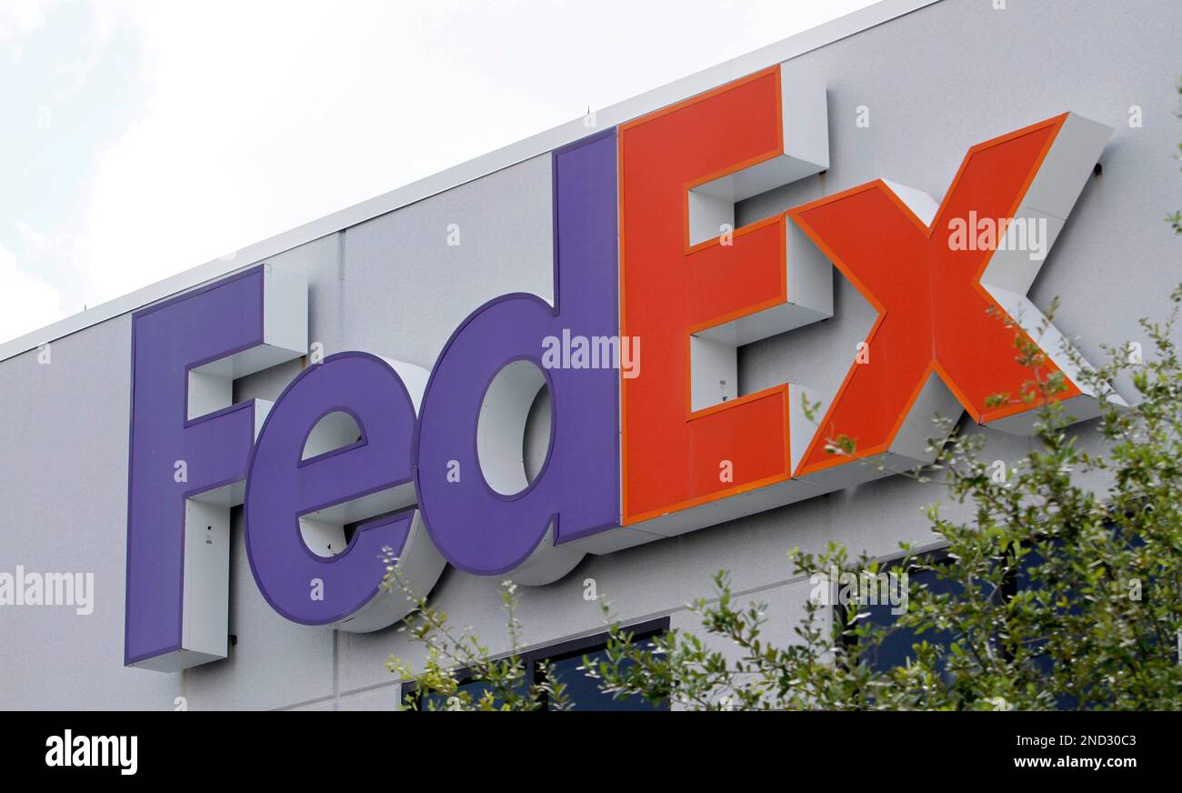 The FedEx sign is shown at Miami International Airport in Miami, Monday ...
