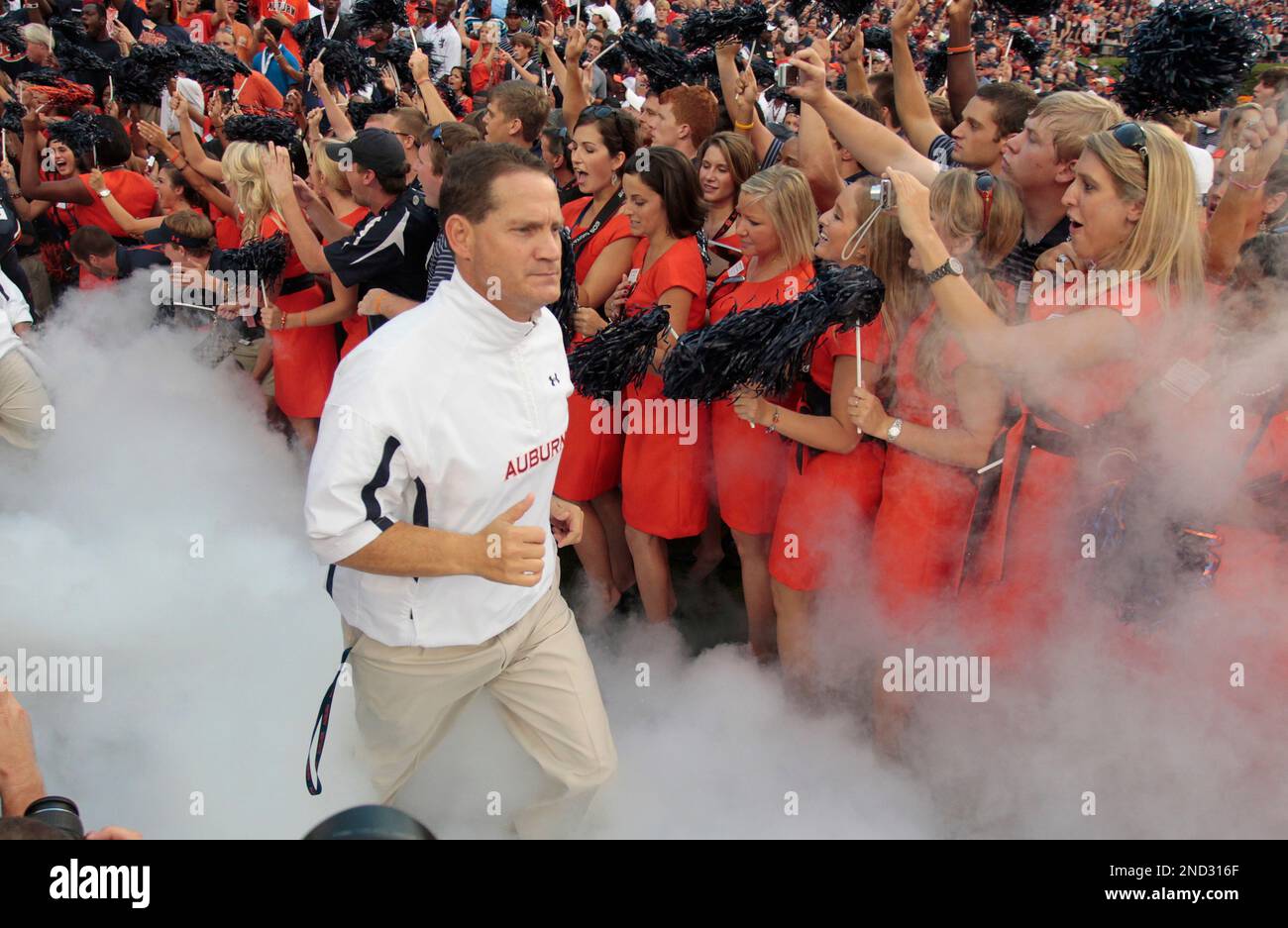Auburn coach Gene Chizik runs on the field prior to their NCAA college ...