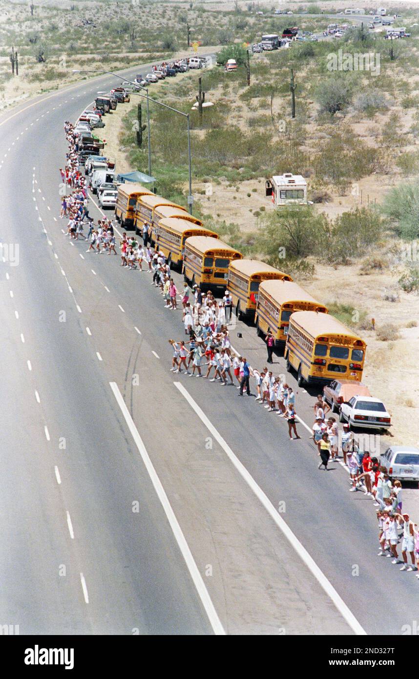 People get carried away and form human waves across Interstate 10 about 25 miles west of Phoenix ...
