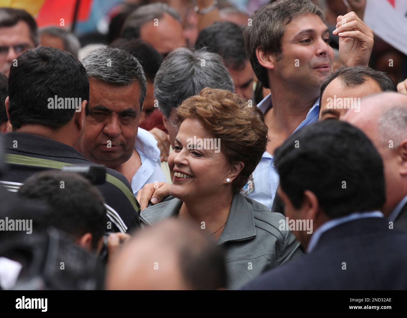 Brazil's Workers party presidential candidate Dilma Rousseff greets ...