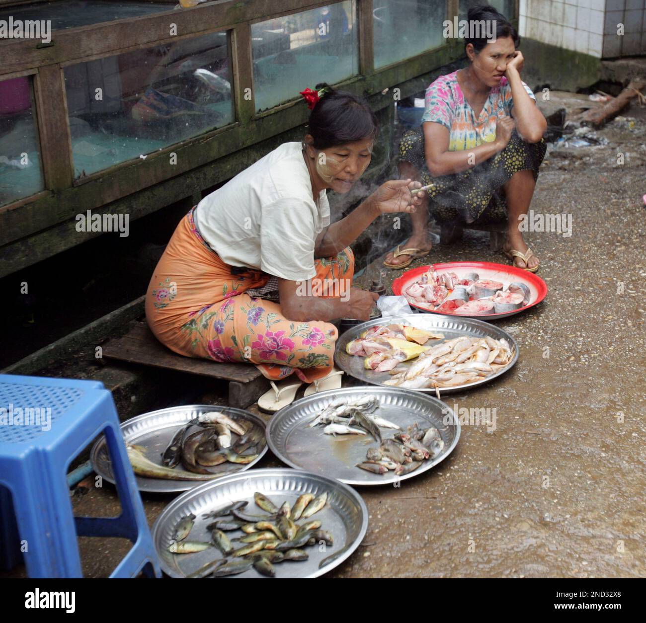 In this photo taken on Sunday, Sept. 19, 2010 Myanmar vendors wait for ...