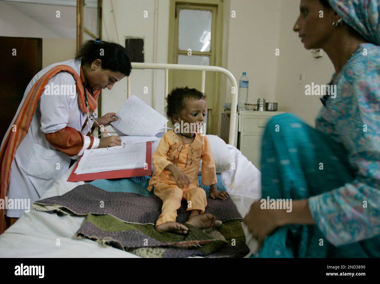 In this Sept. 13, 2010 photo, a malnourished Pakistani boy, who came ...