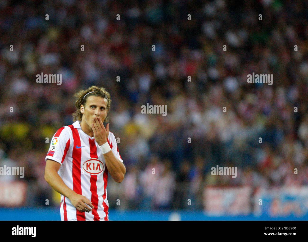 Atletico de Madrid's Diego Forlan from Uruguay reacts during a Spanish ...