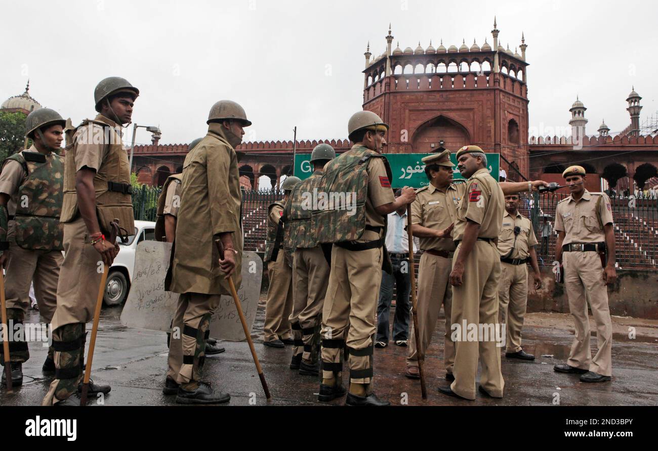 Indian police officers stand guard outside Jama Masjid mosque ...