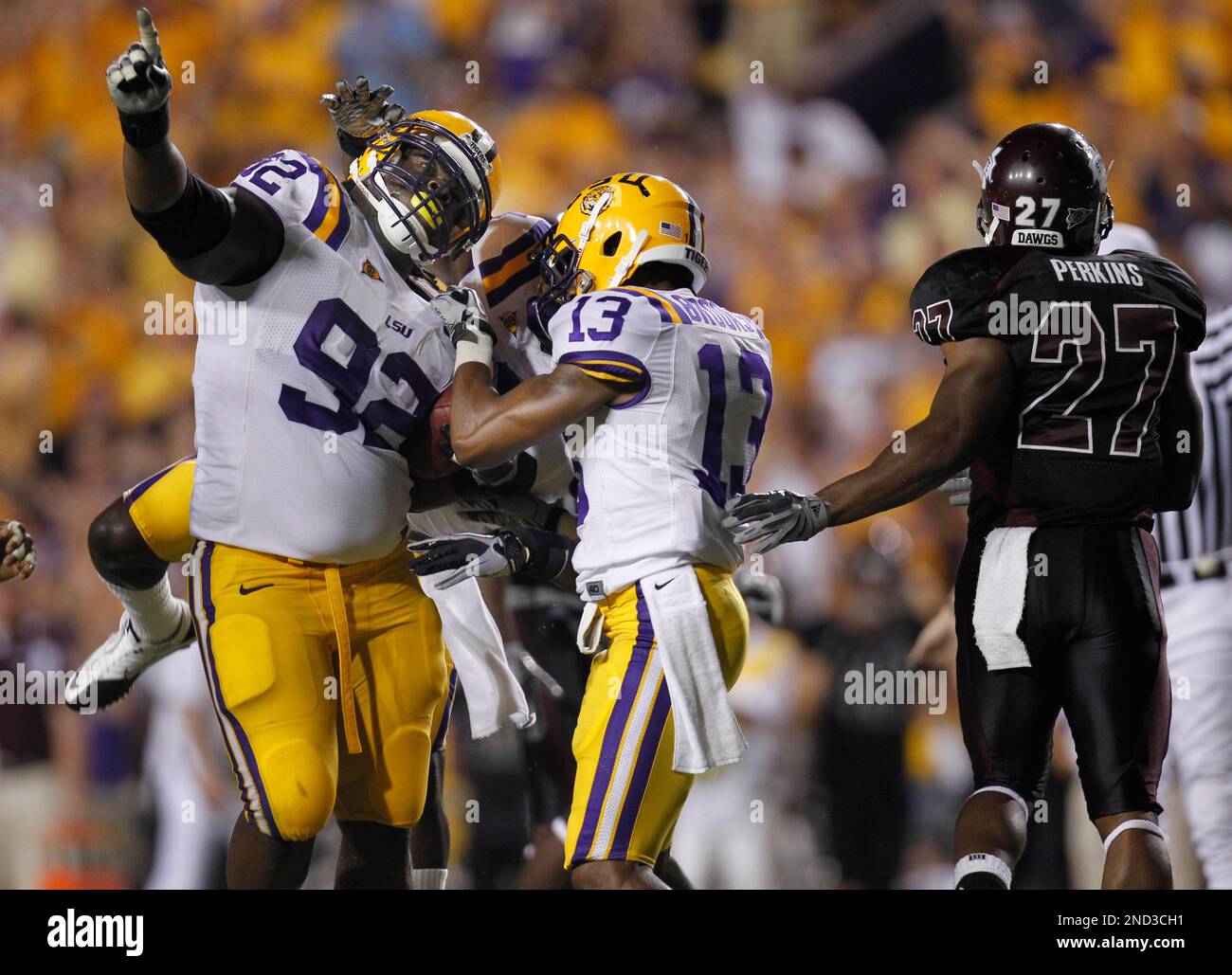 LSU defensive tackle Drake Nevis (92) celebrates his interception ...