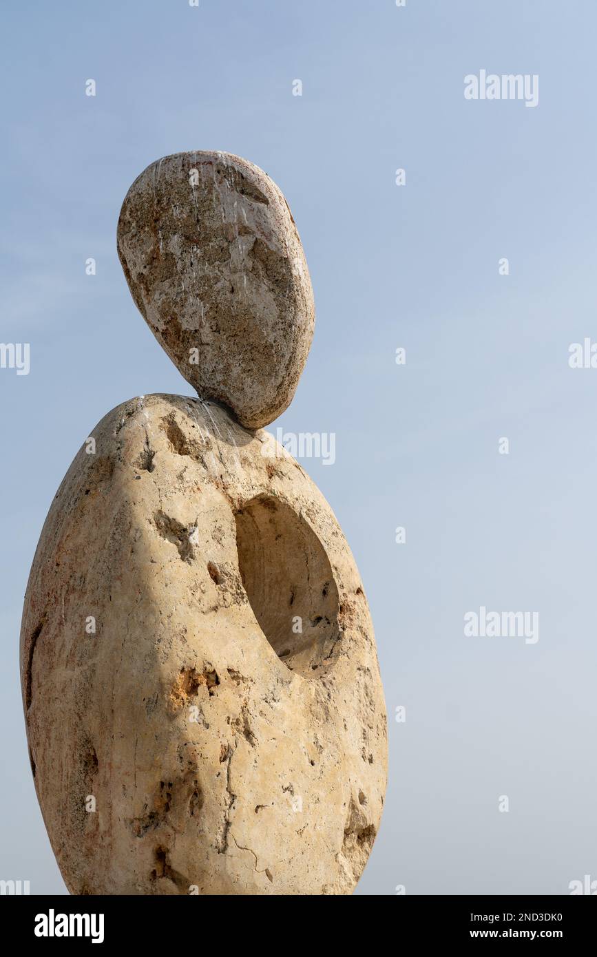 Sculpture symbol made of large pebbles against the blue sky Stock Photo ...