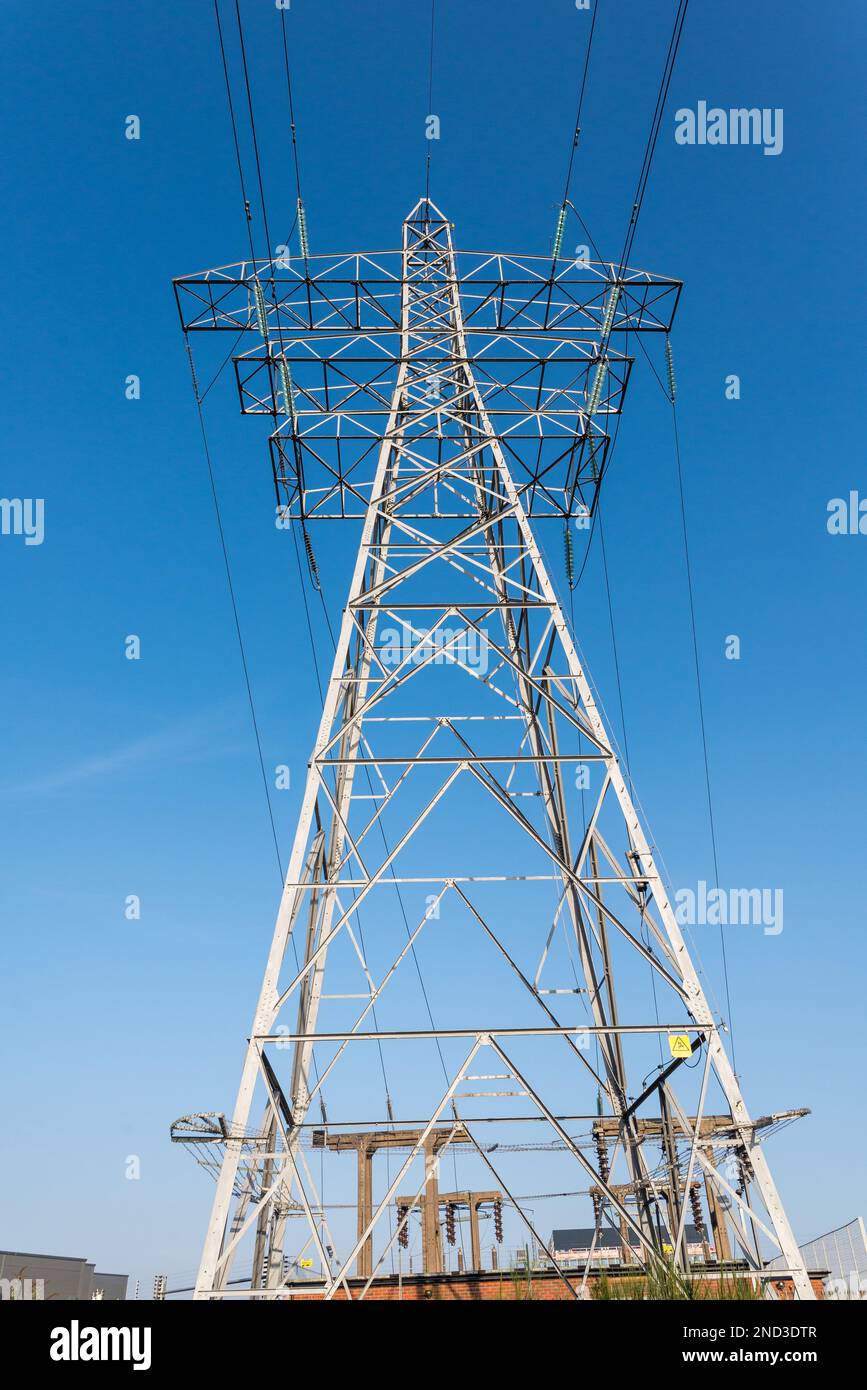 Tall electricity pylon for carrying electricity against blue sky Stock ...